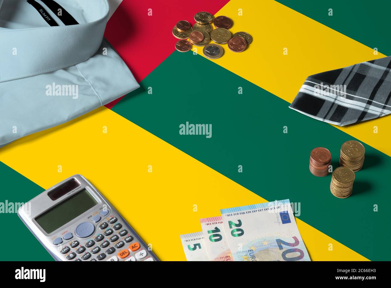 Togo flag on minimal money concept table. Coins and financial objects ...
