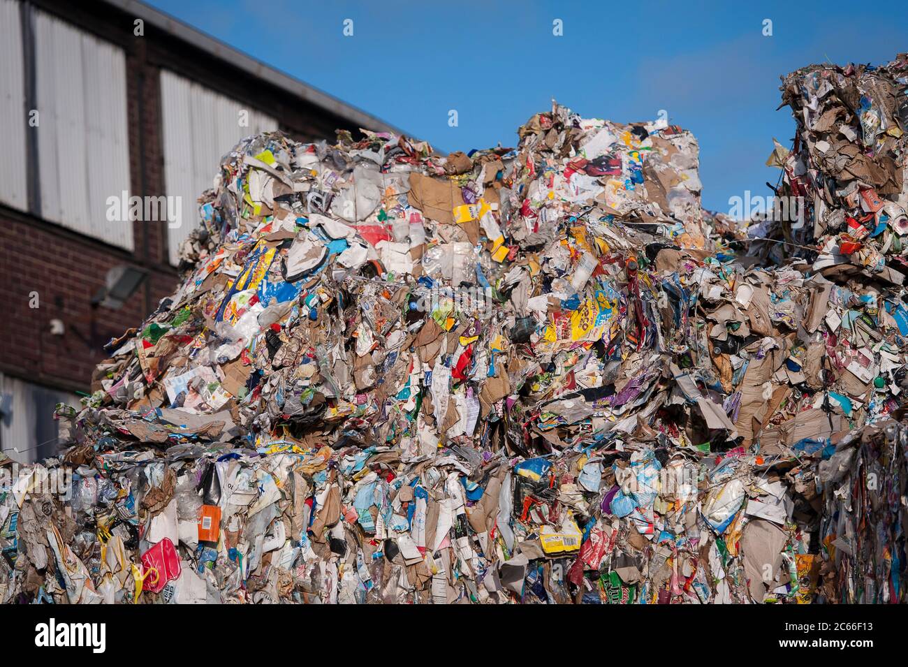 Piles of cardboard at a recycling plant in Liverpool, England, UK Stock ...