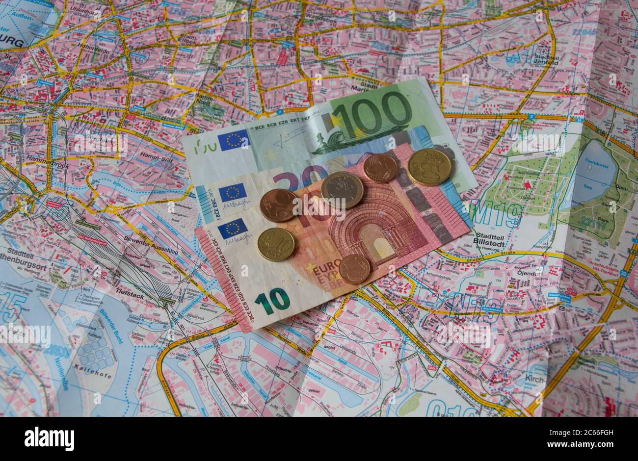 Money Scattered on Tourist Map, travel planing concept Stock Photo - Alamy