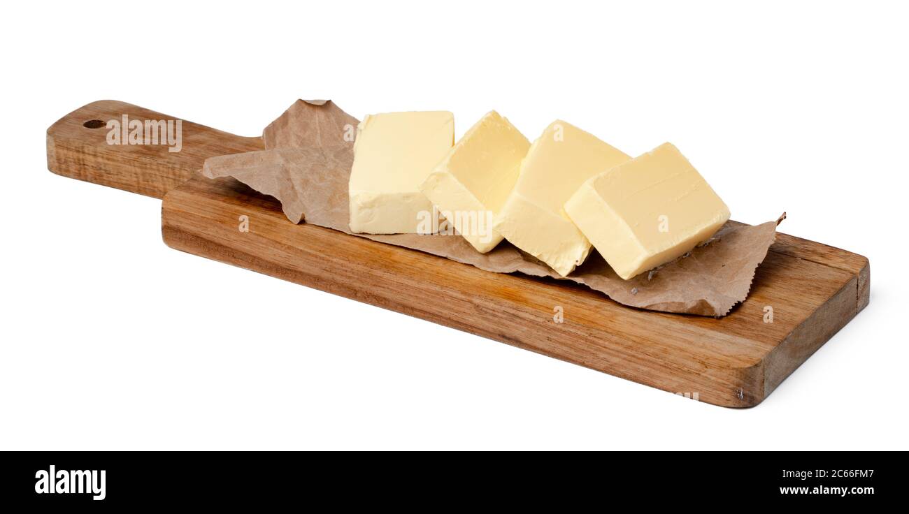 Butter on wooden board isolated on white background Stock Photo - Alamy
