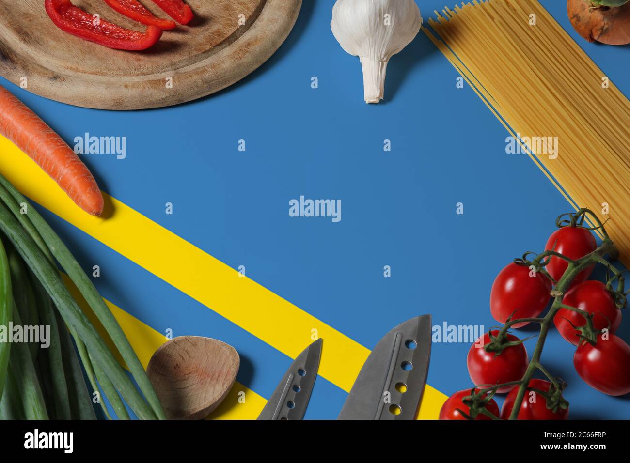 Aruba flag on fresh vegetables and knife concept wooden table. Cooking ...