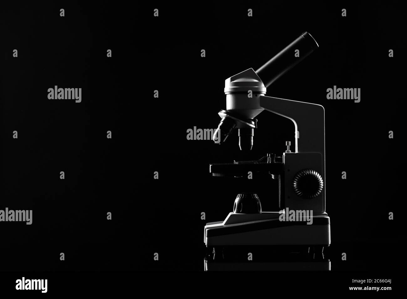 laboratory microscope on table in the dark Stock Photo - Alamy