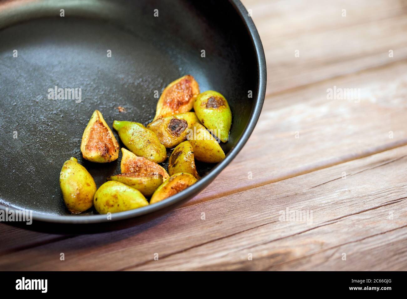 Figs braised in butter in a frying pan hi-res stock photography and ...