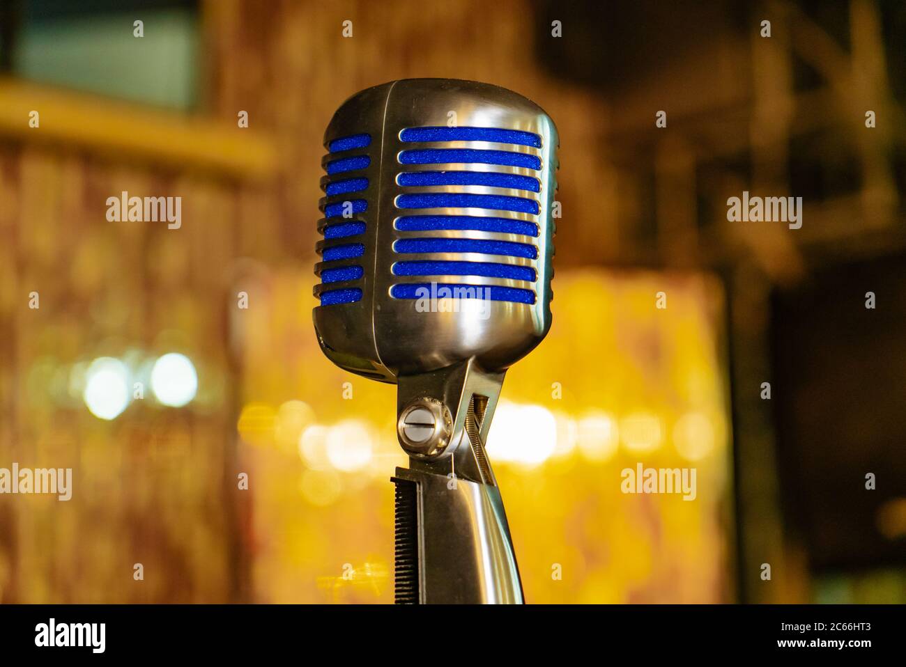 microphone with blue inserts stands on the background of the concert ...