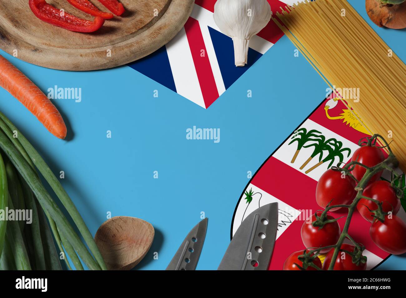 Fiji flag on fresh vegetables and knife concept wooden table. Cooking ...