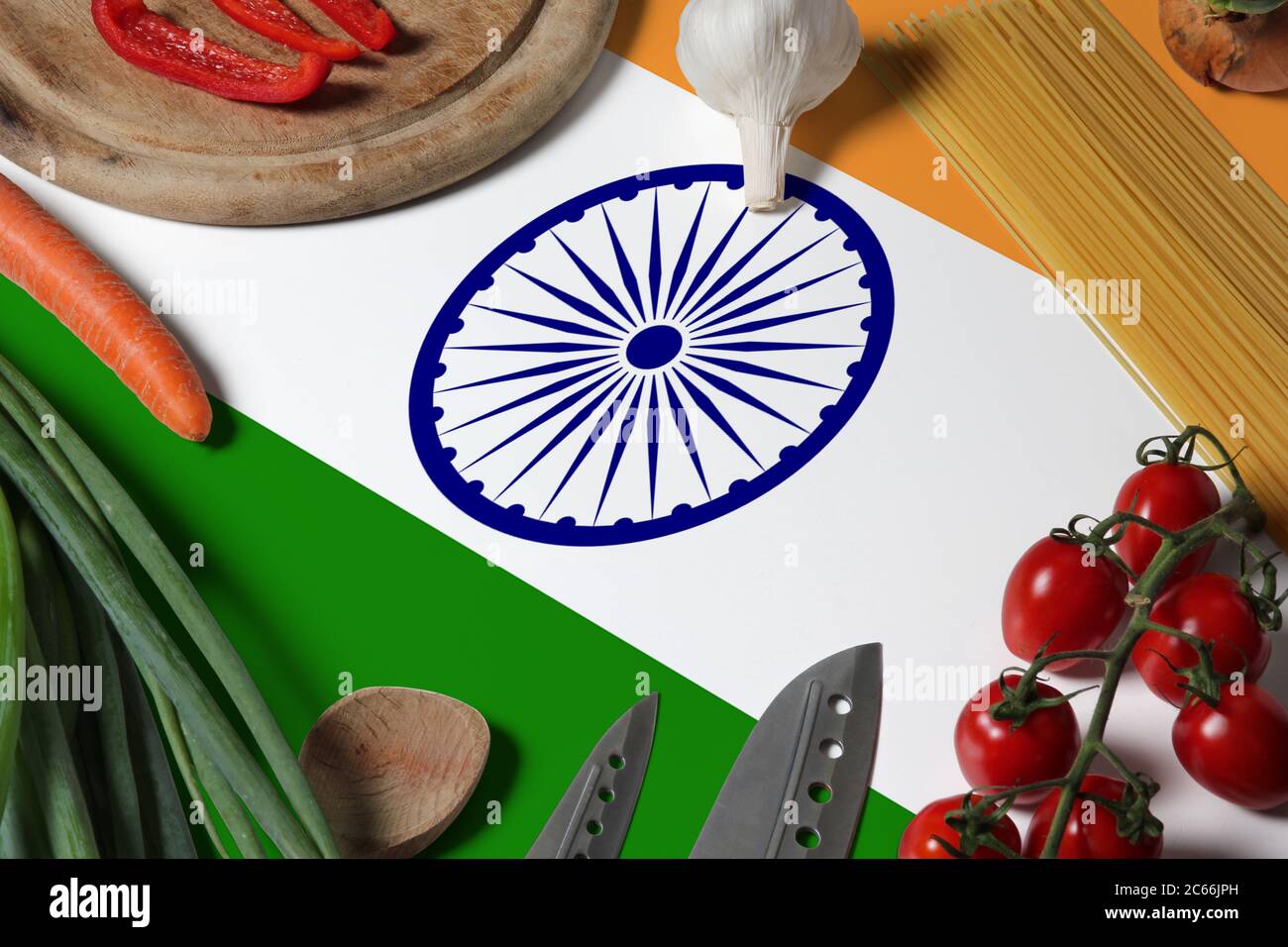 India flag on fresh vegetables and knife concept wooden table. Cooking ...