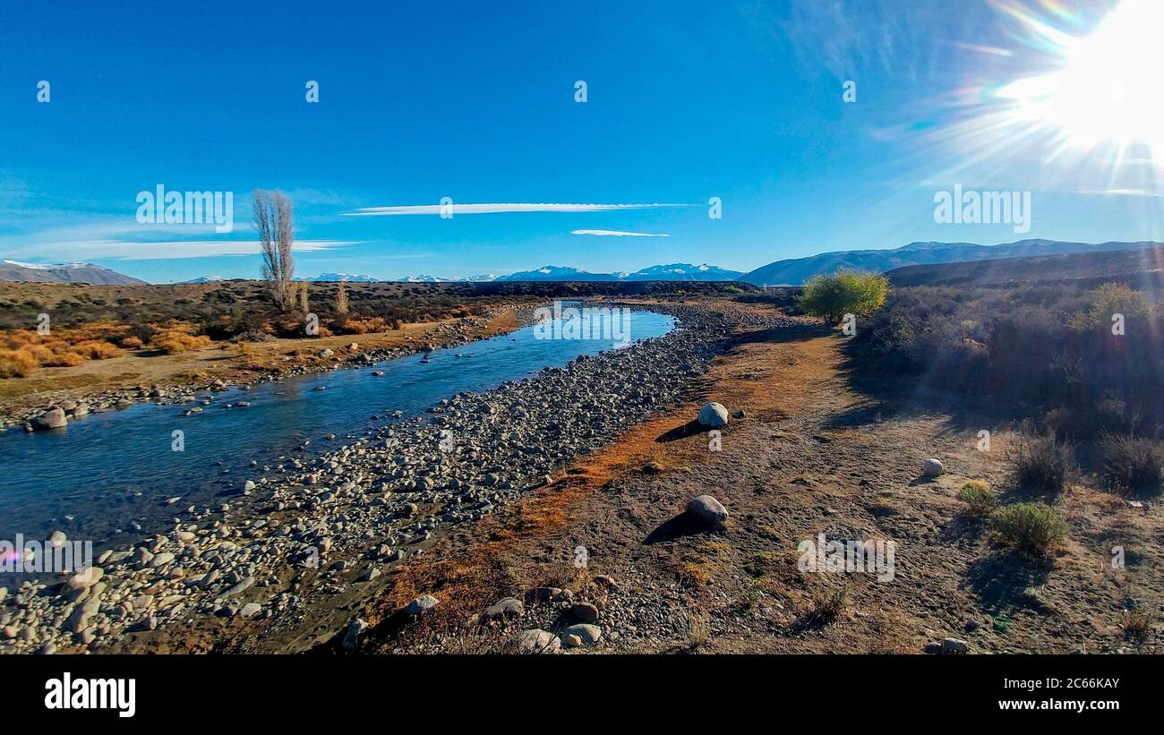 River through barren landscape, Argentina Stock Photo - Alamy