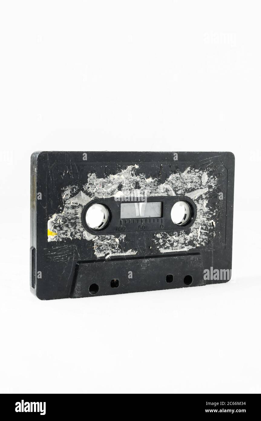 Ancient Vintage Used Musicassette over a White Background Stock Photo ...