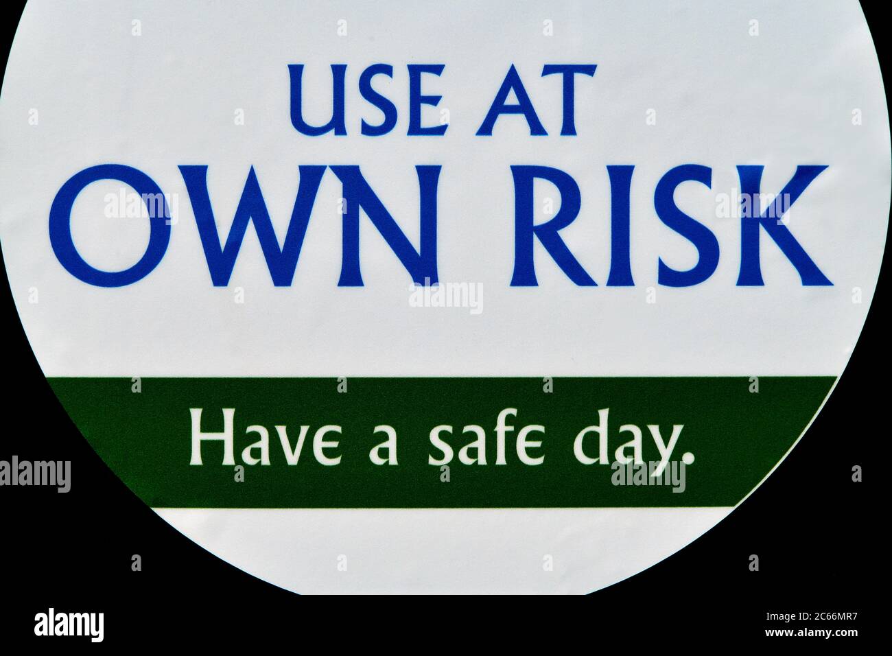 A warning sign telling people that they may use this facility at thier ...