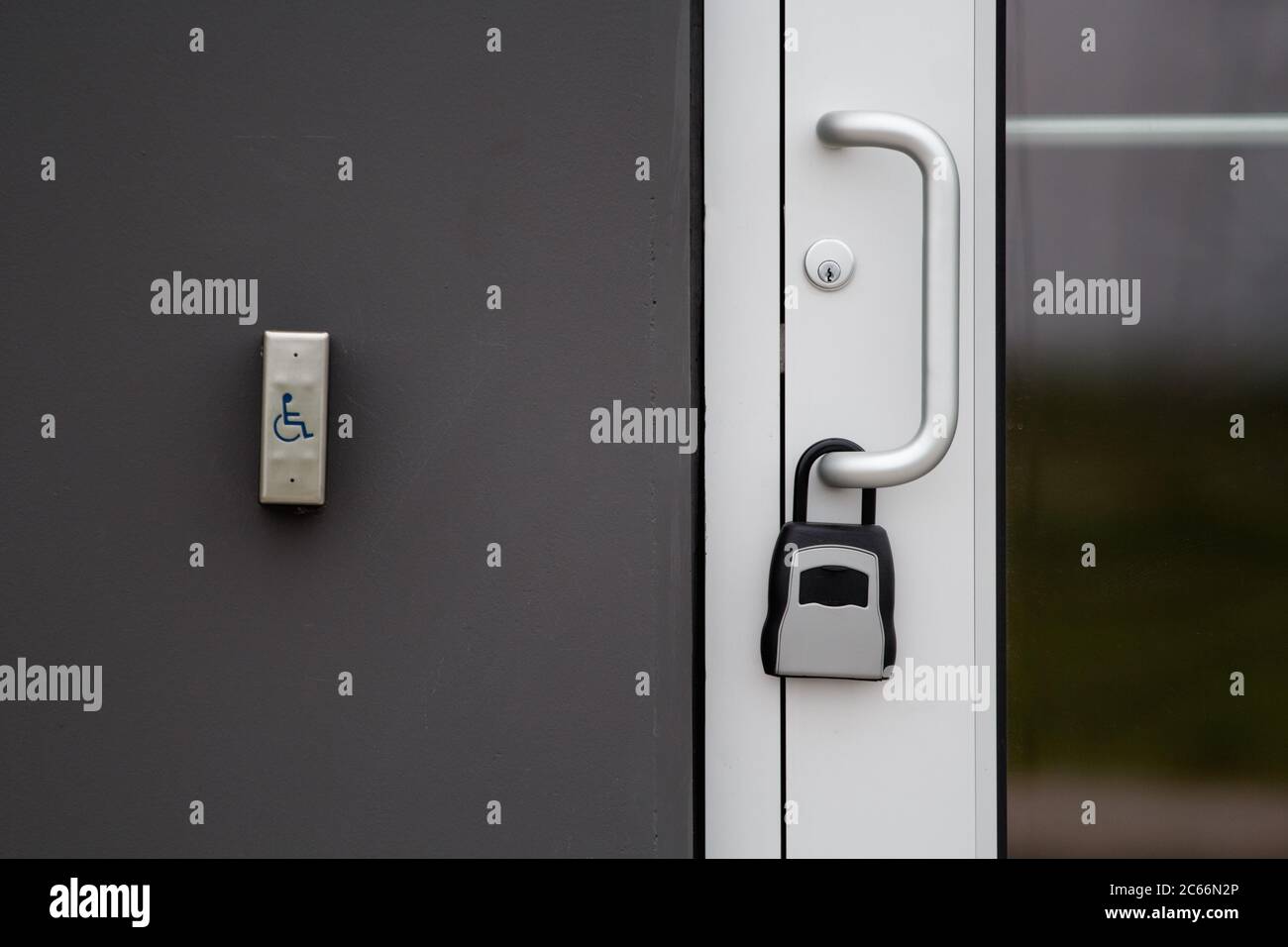 Office building door with electronic padlock and accessibility push ...