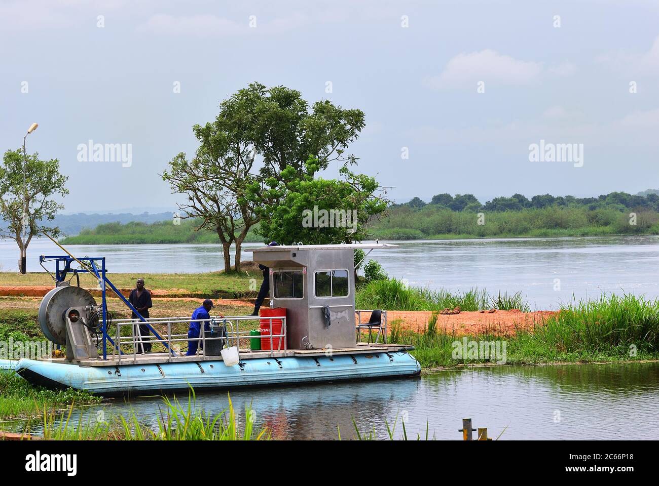 Ferry crossing Victoria Nile river shown at early morning, Uganda ...