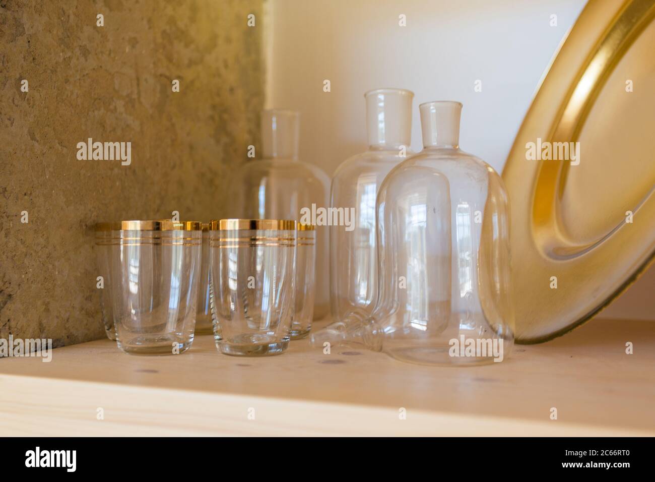 classic glassware on a wooden shelf. cookware collection Stock Photo ...