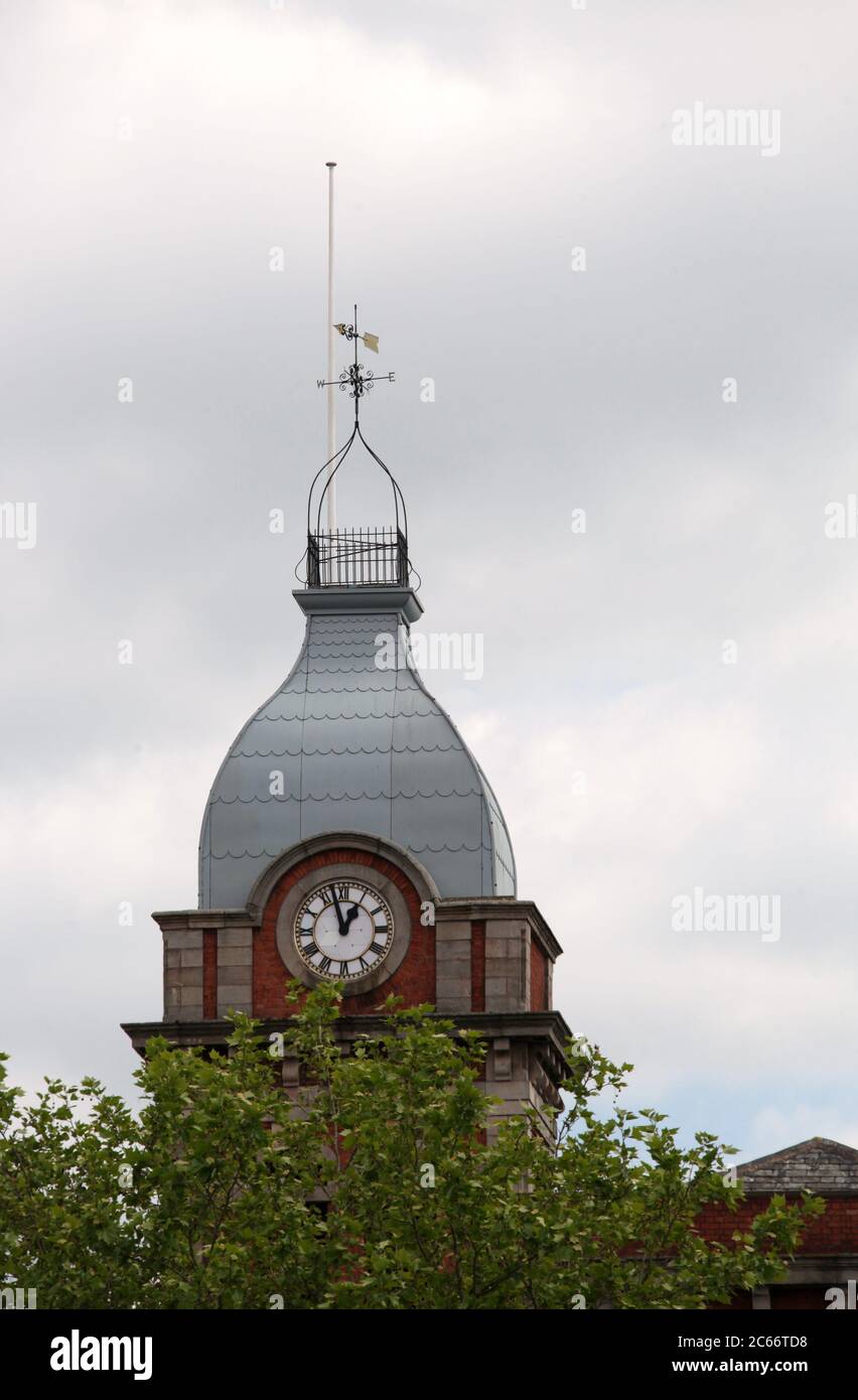 Clock tower with a weather vane at the historic market hall in ...
