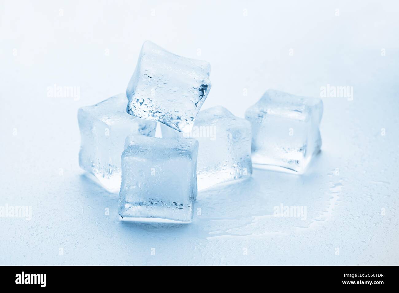 Melted ice cubes close up isolated on white background Stock Photo - Alamy