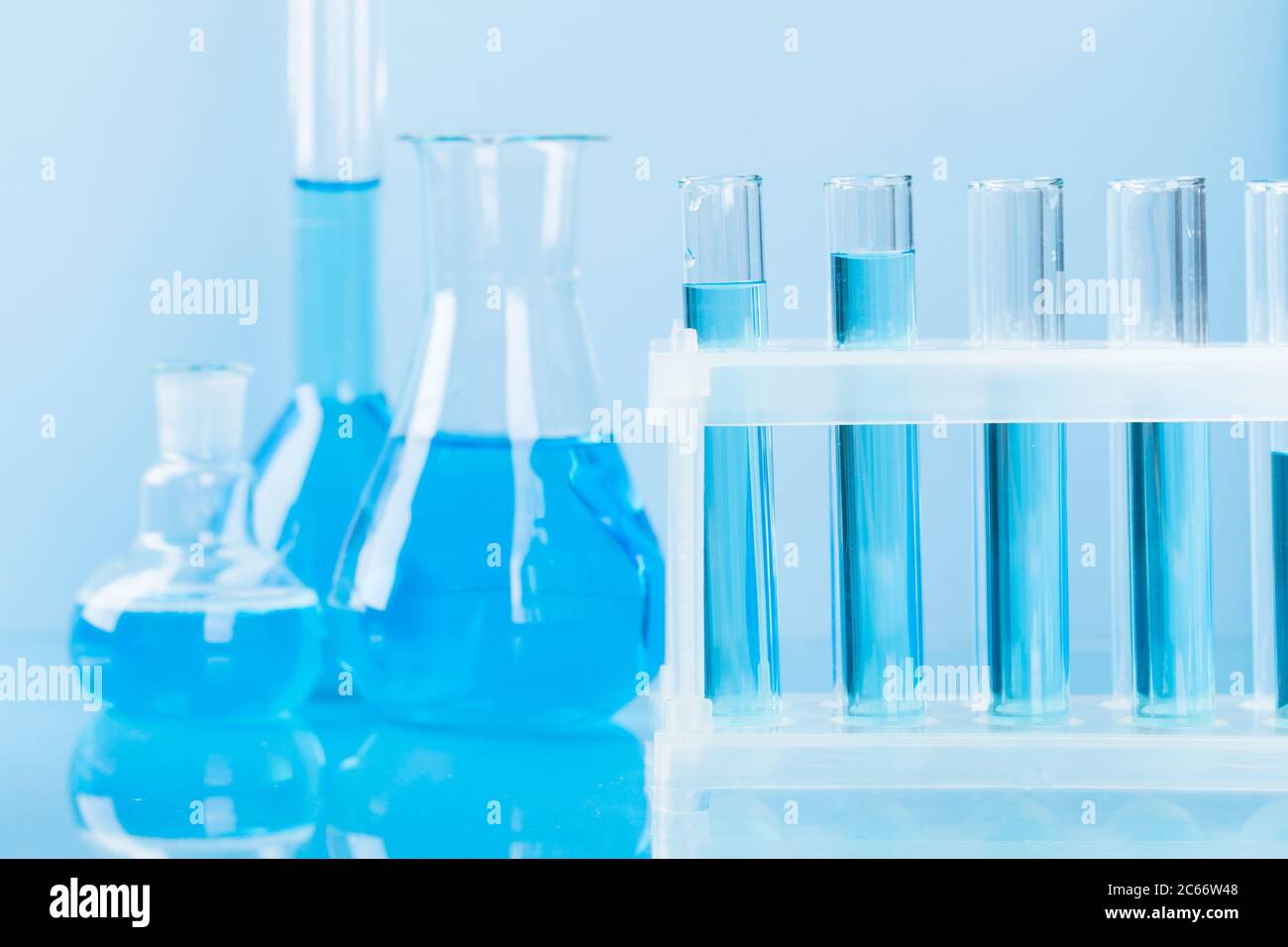 Laboratory glassware with a pipette and test tubes. scientific ...