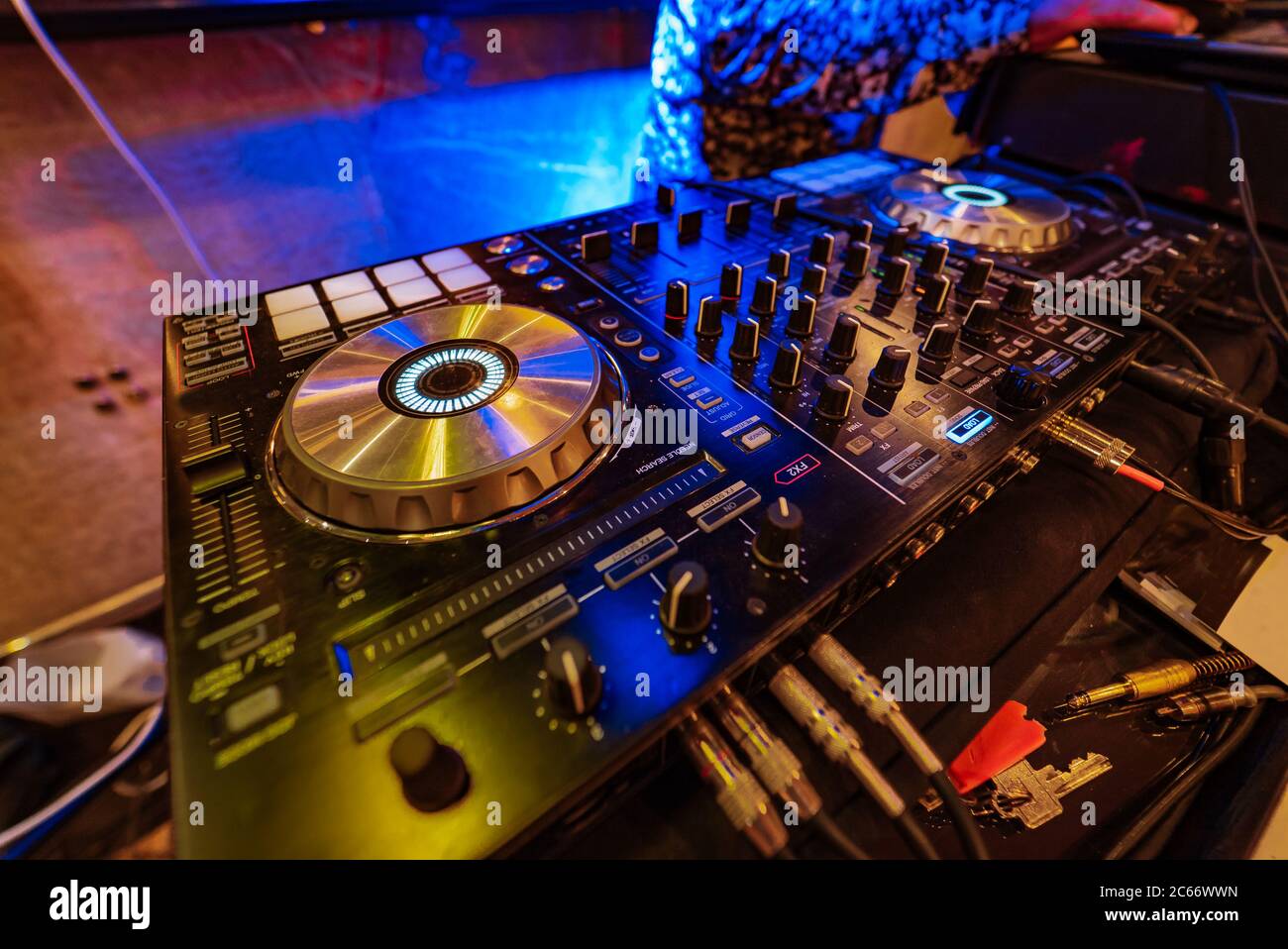 professional mixer console with vinyl discs for dj is in the party ...