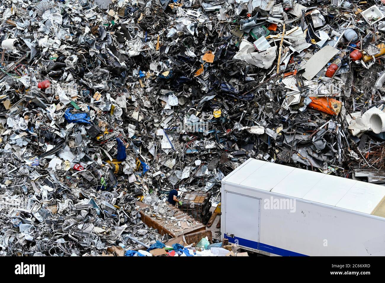 Mannheim, Germany. 07th July, 2020. A man is unloading scrap metal from ...