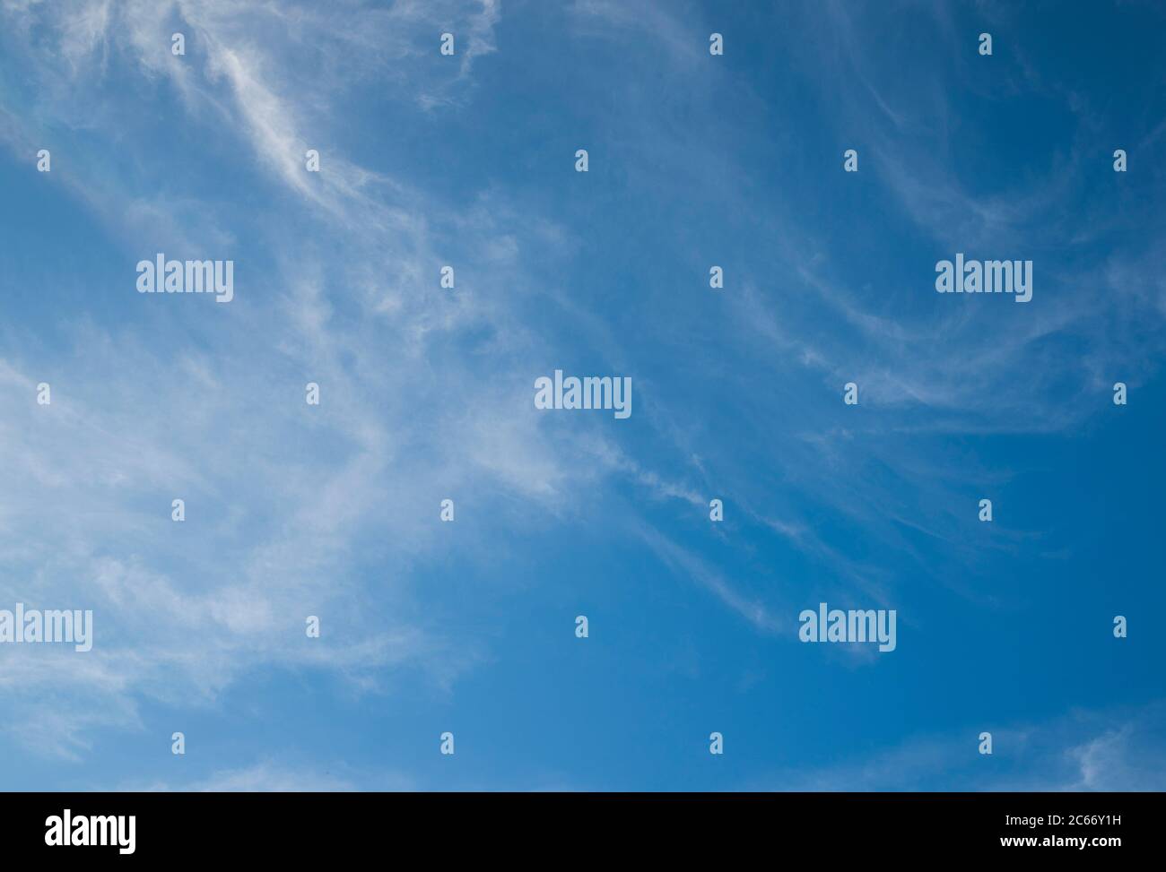 Fast moving clouds during a sunny day in the blue sky with the ...