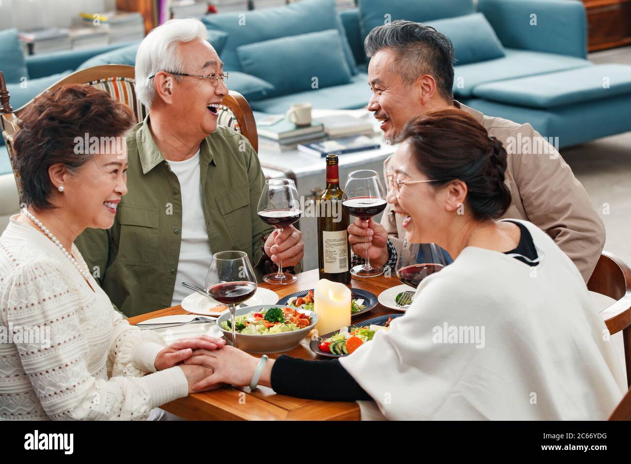 Happy middle-aged and old friend for dinner Stock Photo - Alamy