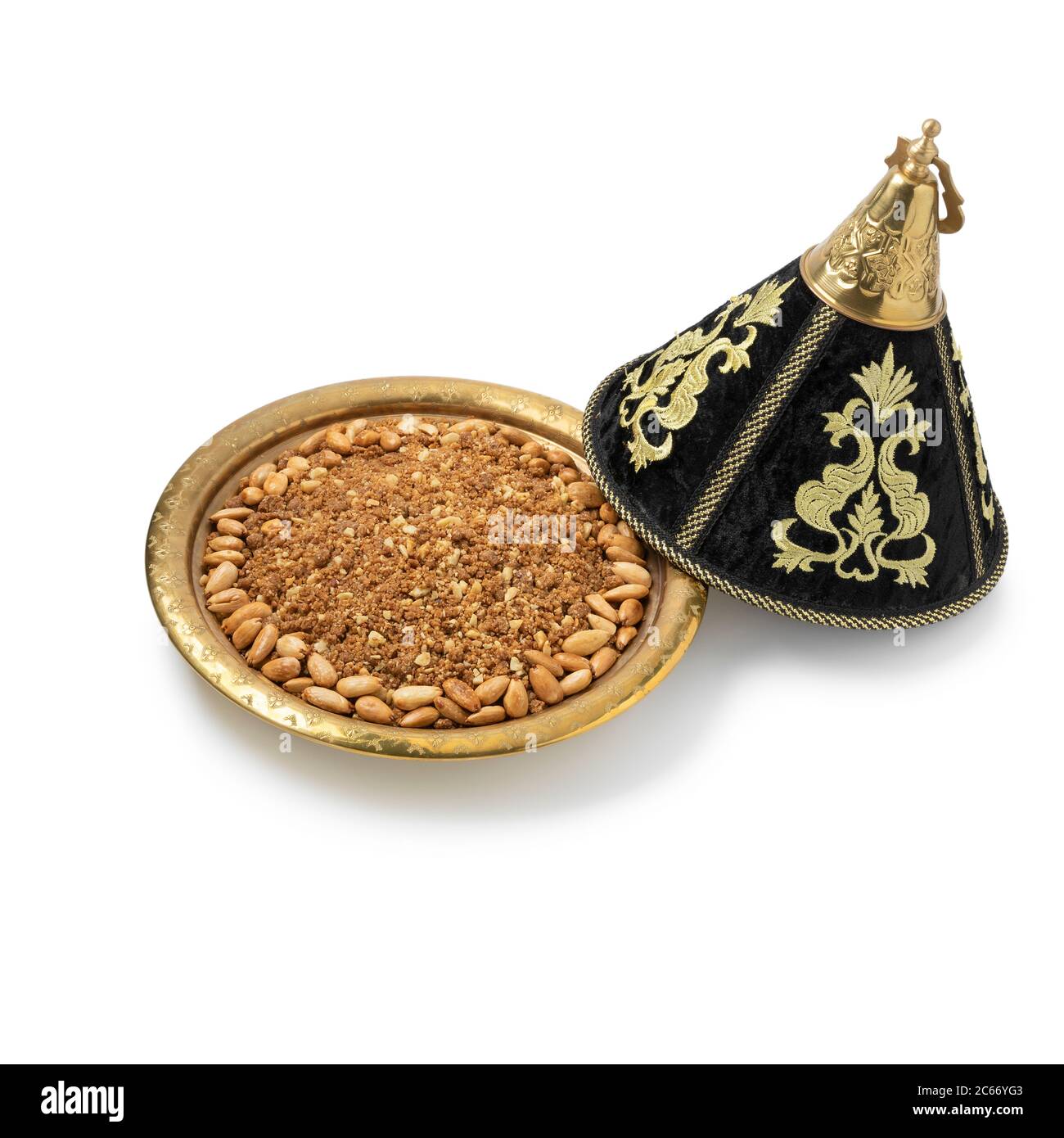 Traditional Moroccan homemade sellou on a metal tajine isolated on ...