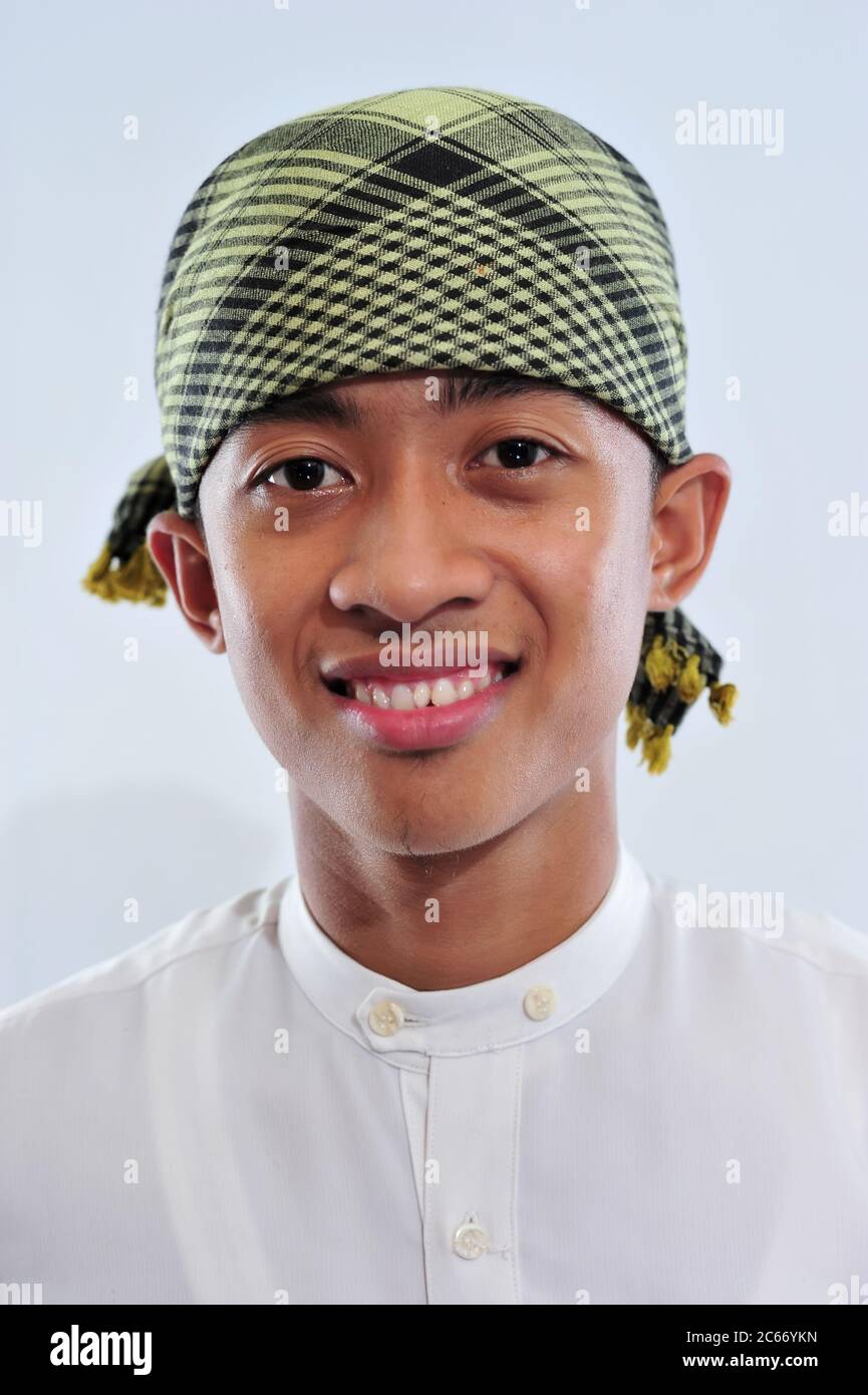 Portrait of handsome muslim man smiling isolated on white background ...