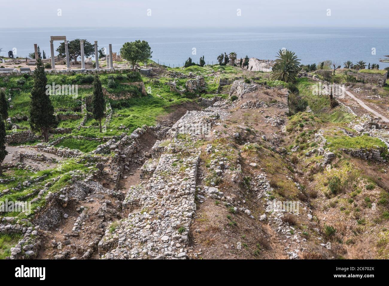 Remains of ancient temple and Roman columns on background next to ...