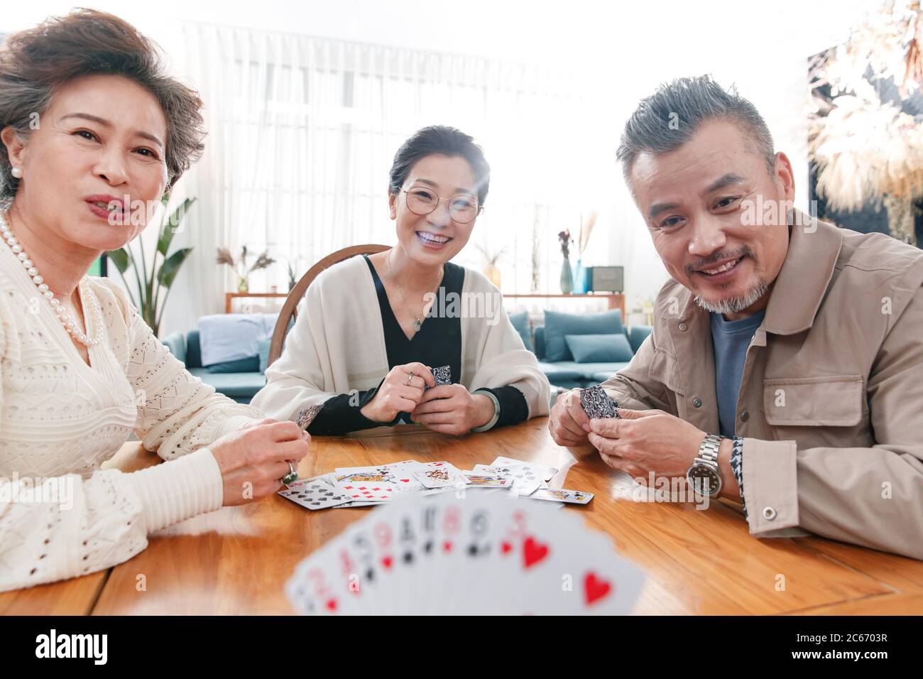 An old friend of happy playing CARDS Stock Photo - Alamy