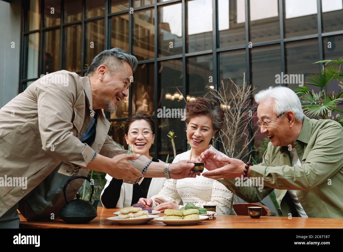 Elderly young tea party hi-res stock photography and images - Alamy