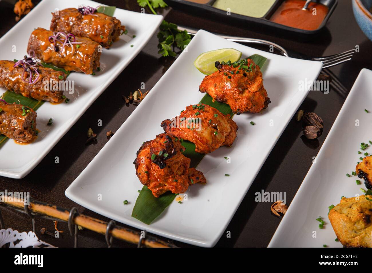 Different dishes of Indian cuisine are served at the table. Isolated ...