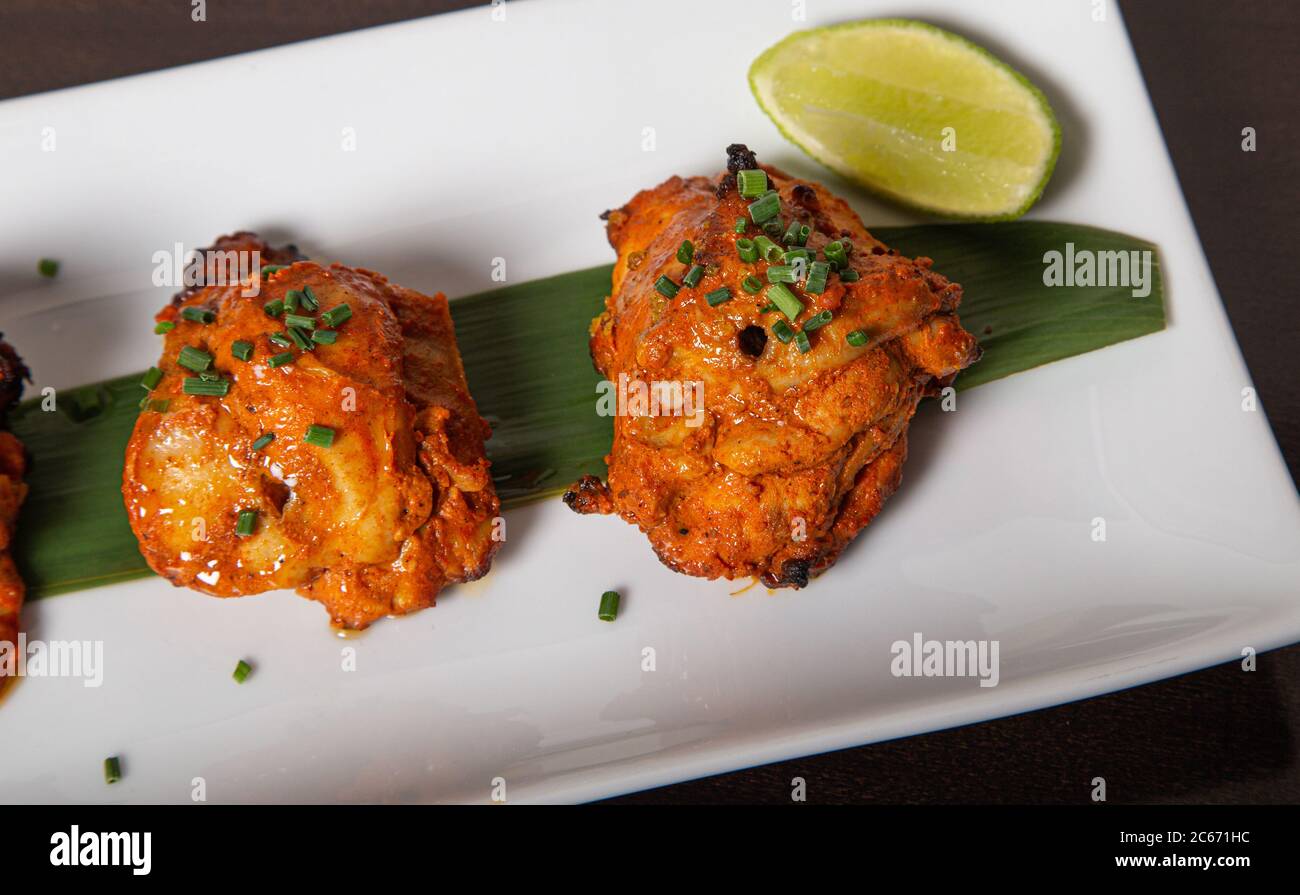 Spicy chicken fillet, marinated rustic style in spice yogurt and ...