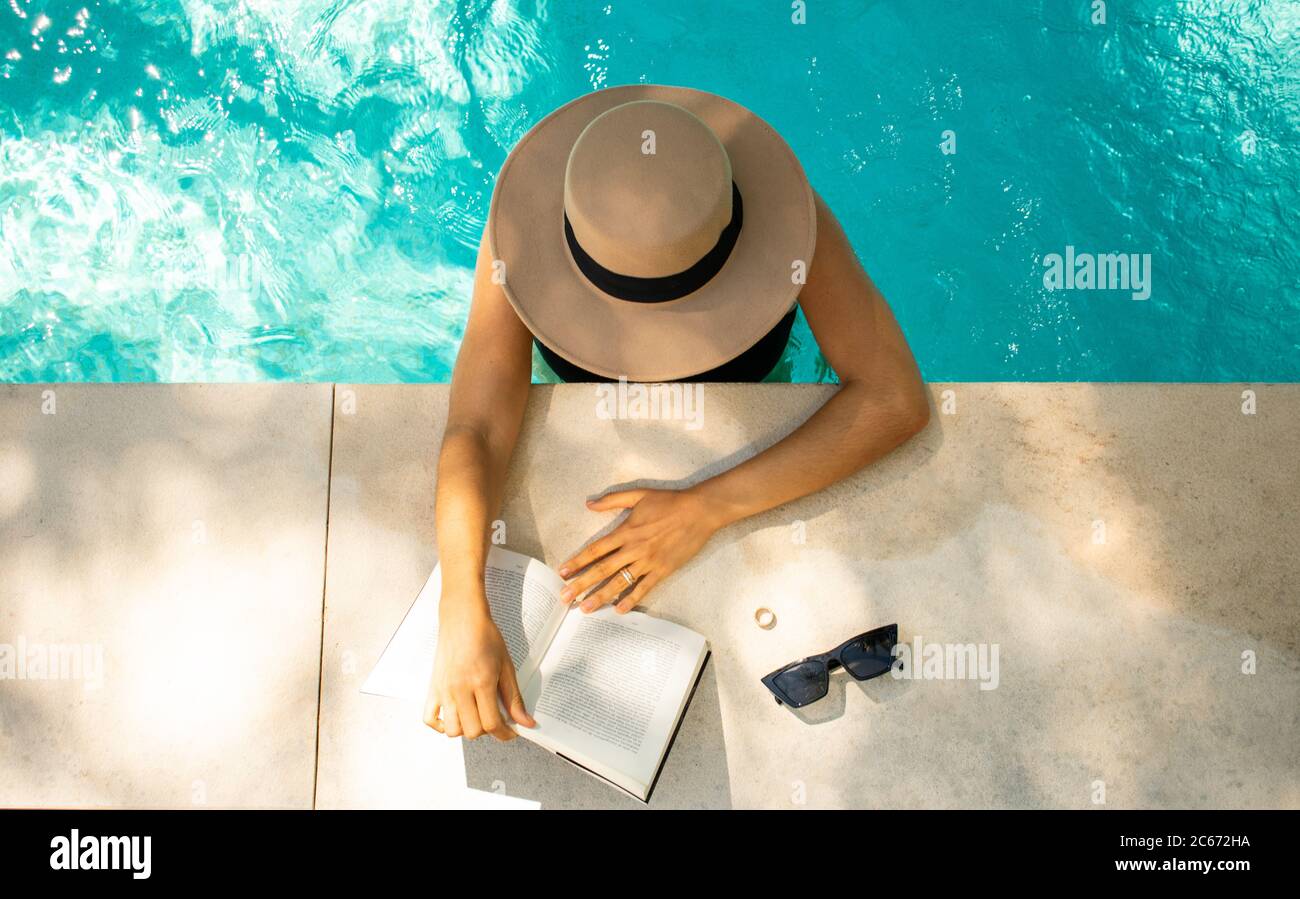 Reading outside pool hi-res stock photography and images - Alamy