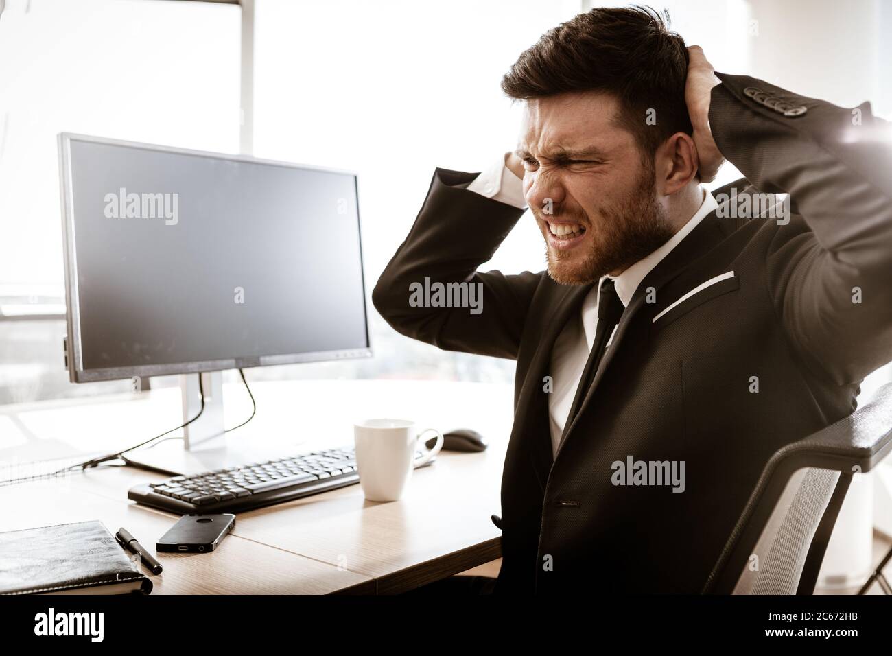 Business crisis concept. Emotional young businessman at work. Worried ...