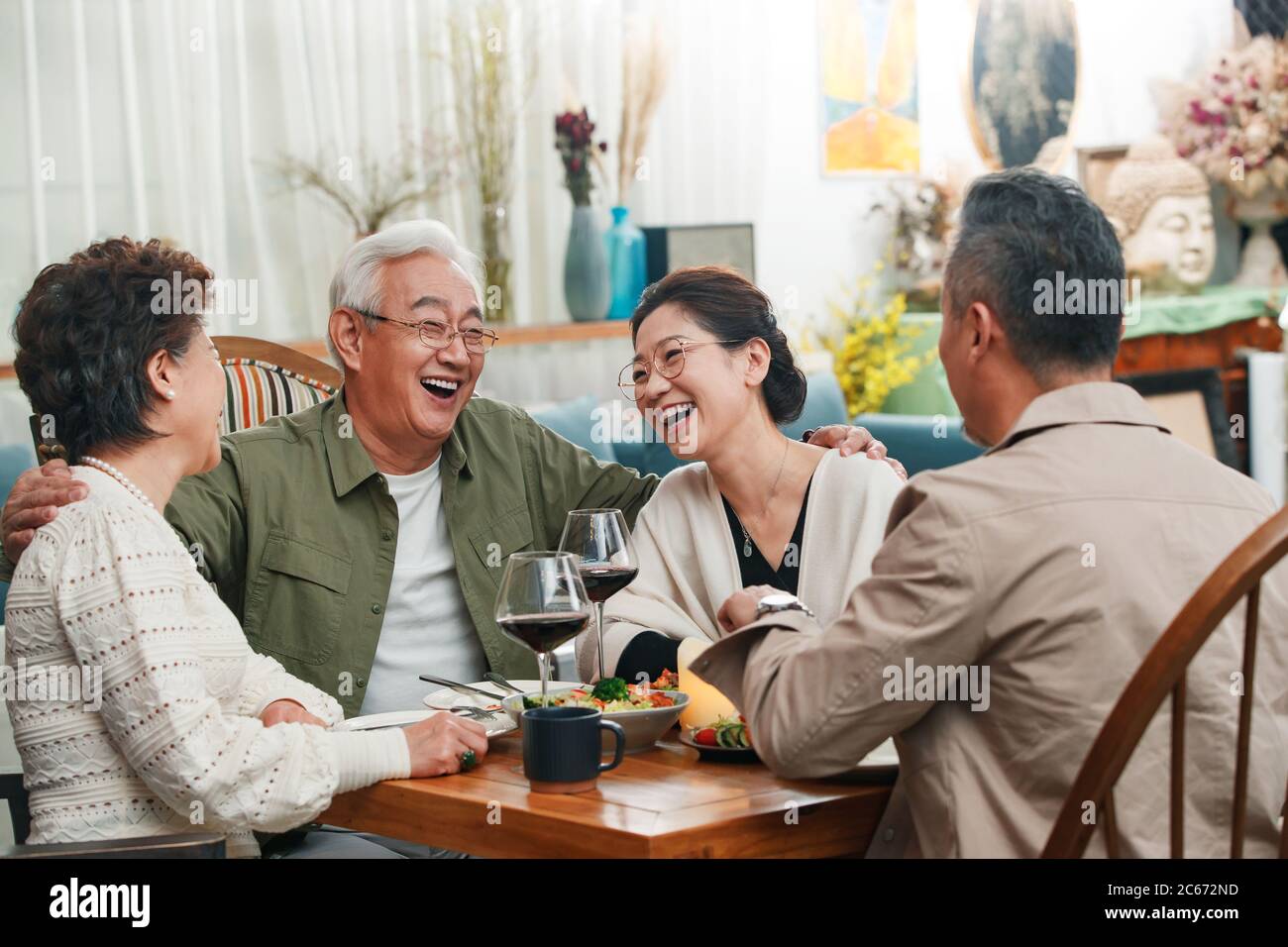Happy middle-aged and old friend for dinner Stock Photo - Alamy