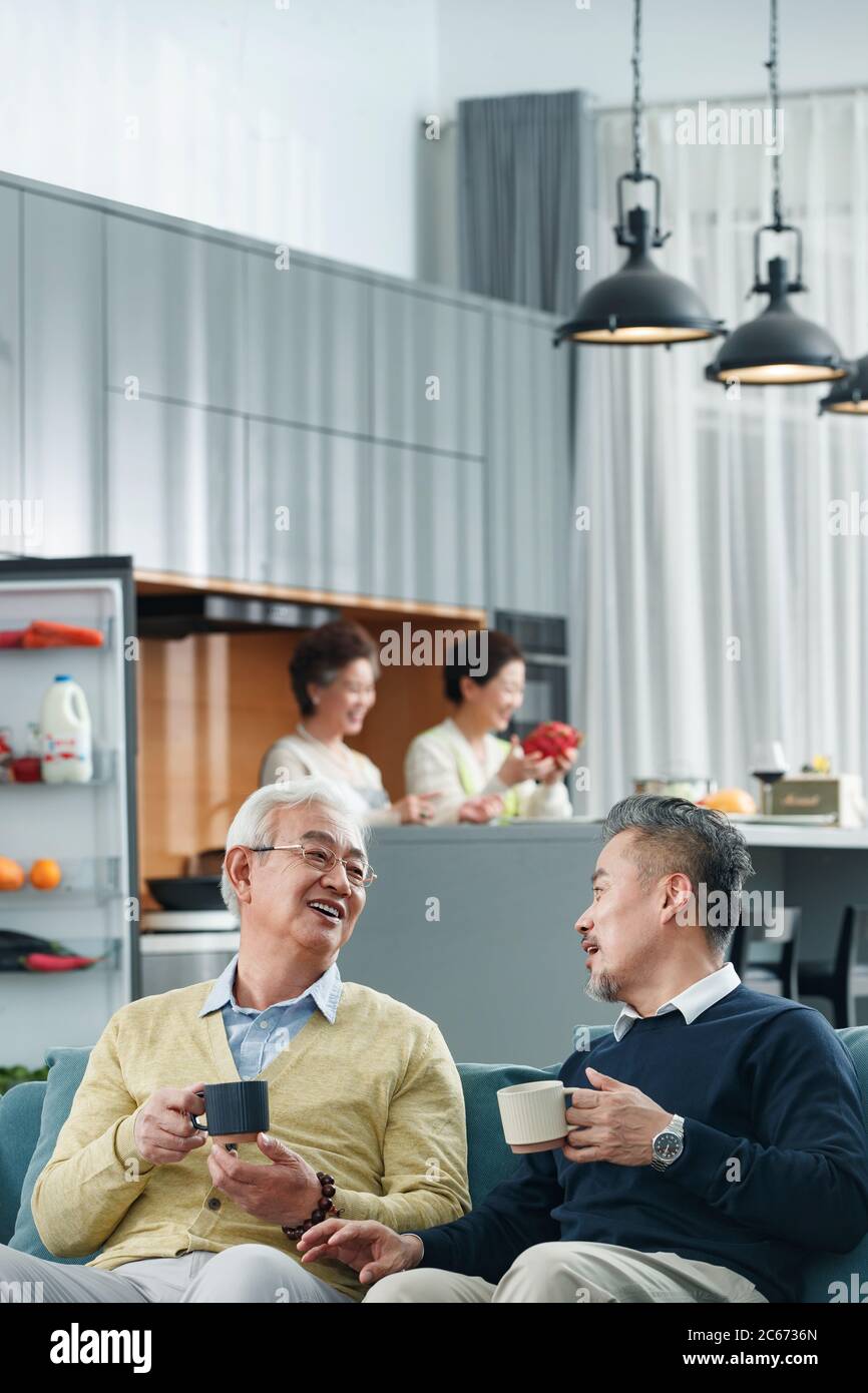 Merry old brothers to chat over a cup of tea Stock Photo - Alamy