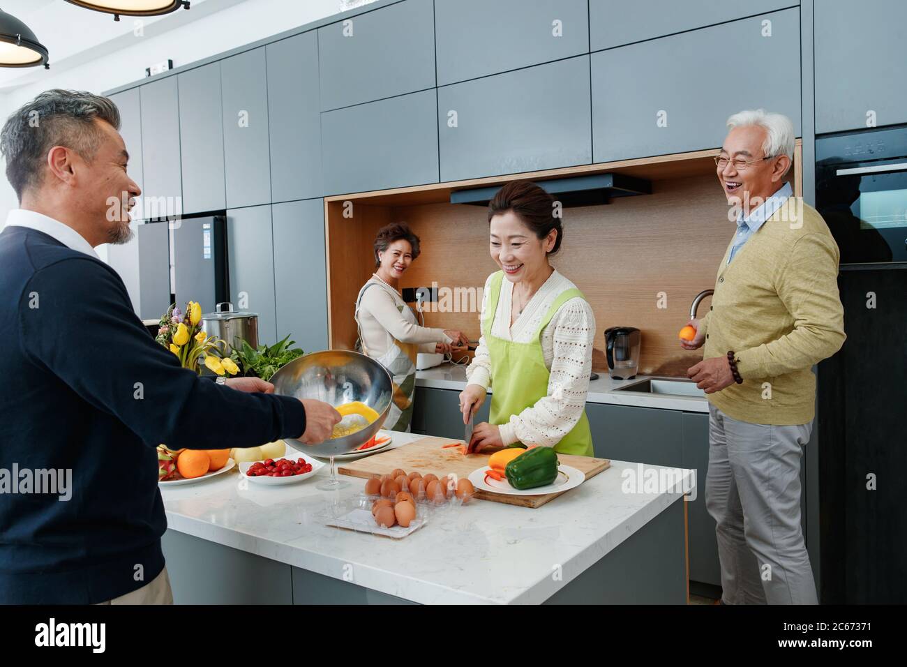 The elderly in the kitchen cooking Stock Photo - Alamy
