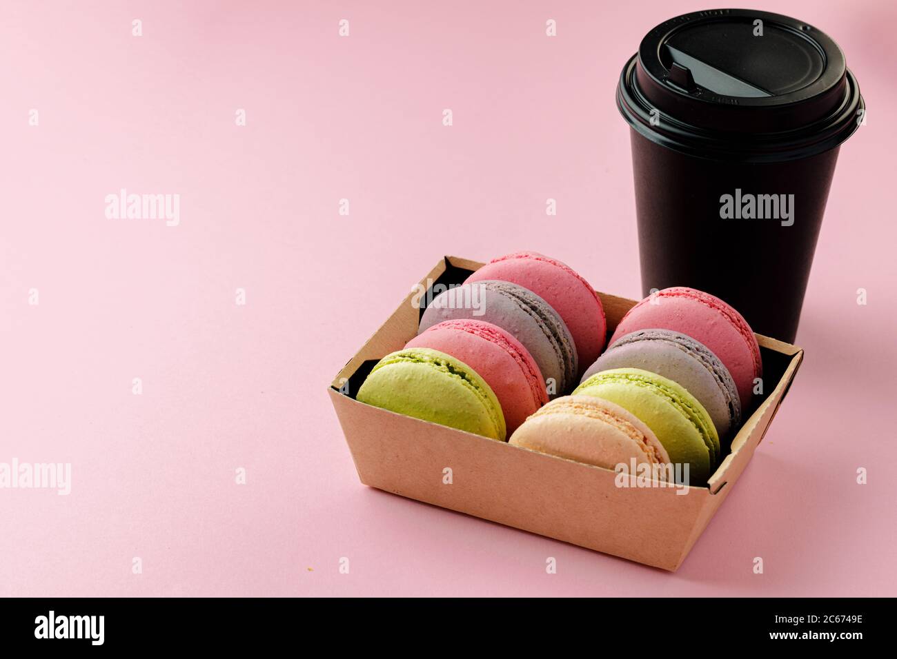 Pile of colorful macaroon cookies on pink background Stock Photo - Alamy