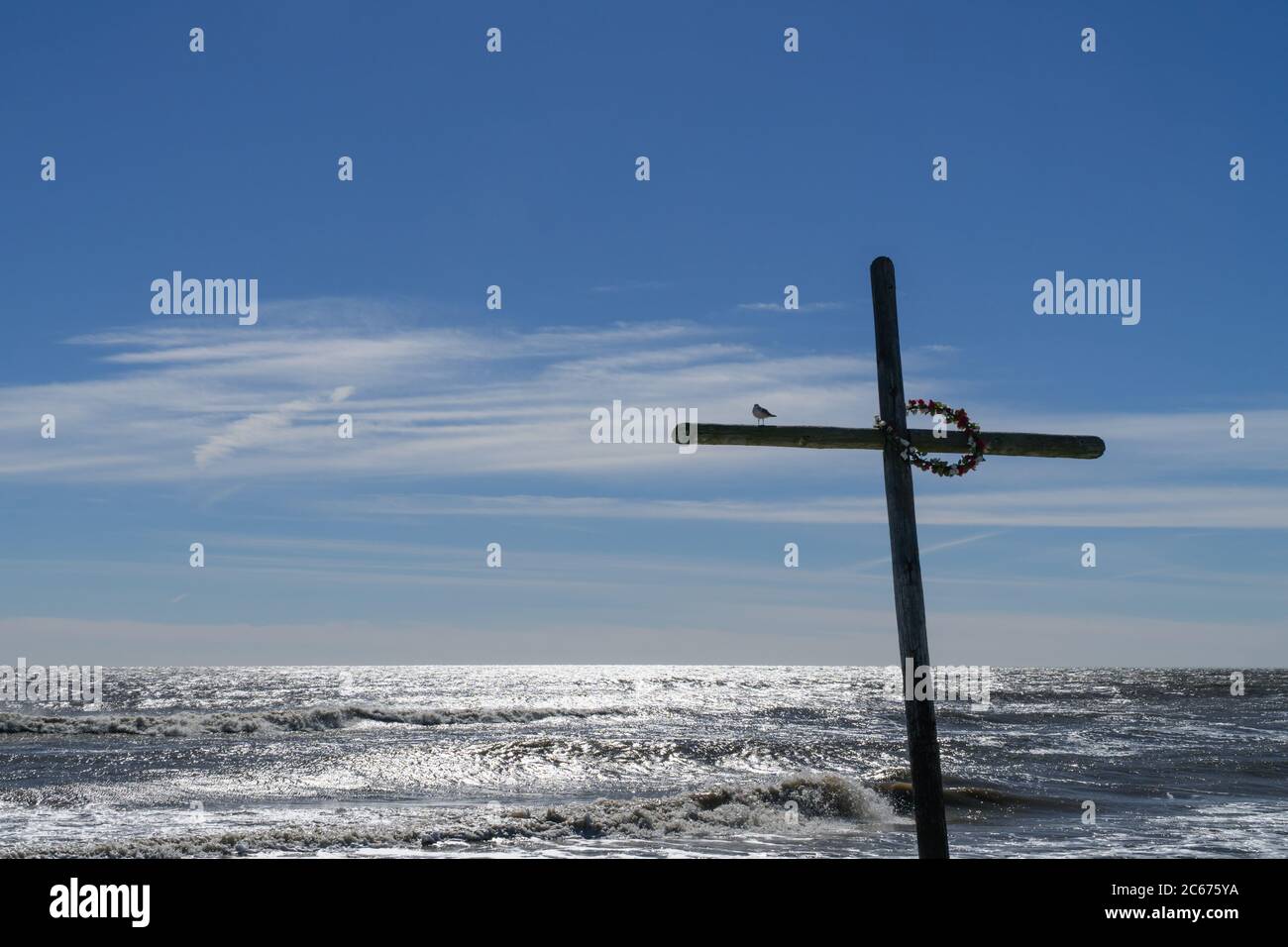 Wooden cross on beach near ocean Stock Photo - Alamy