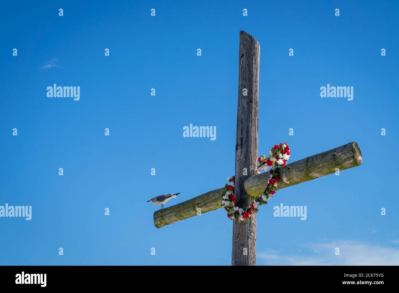 Wooden cross on beach near ocean Stock Photo - Alamy