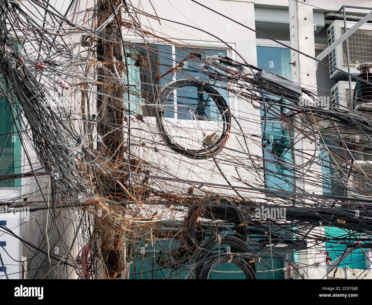 Messy electrical cables on pole hi-res stock photography and images - Alamy