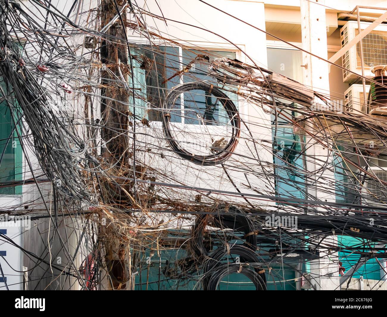 messy chaos wires cables , telephone and internet fiber signal line on ...