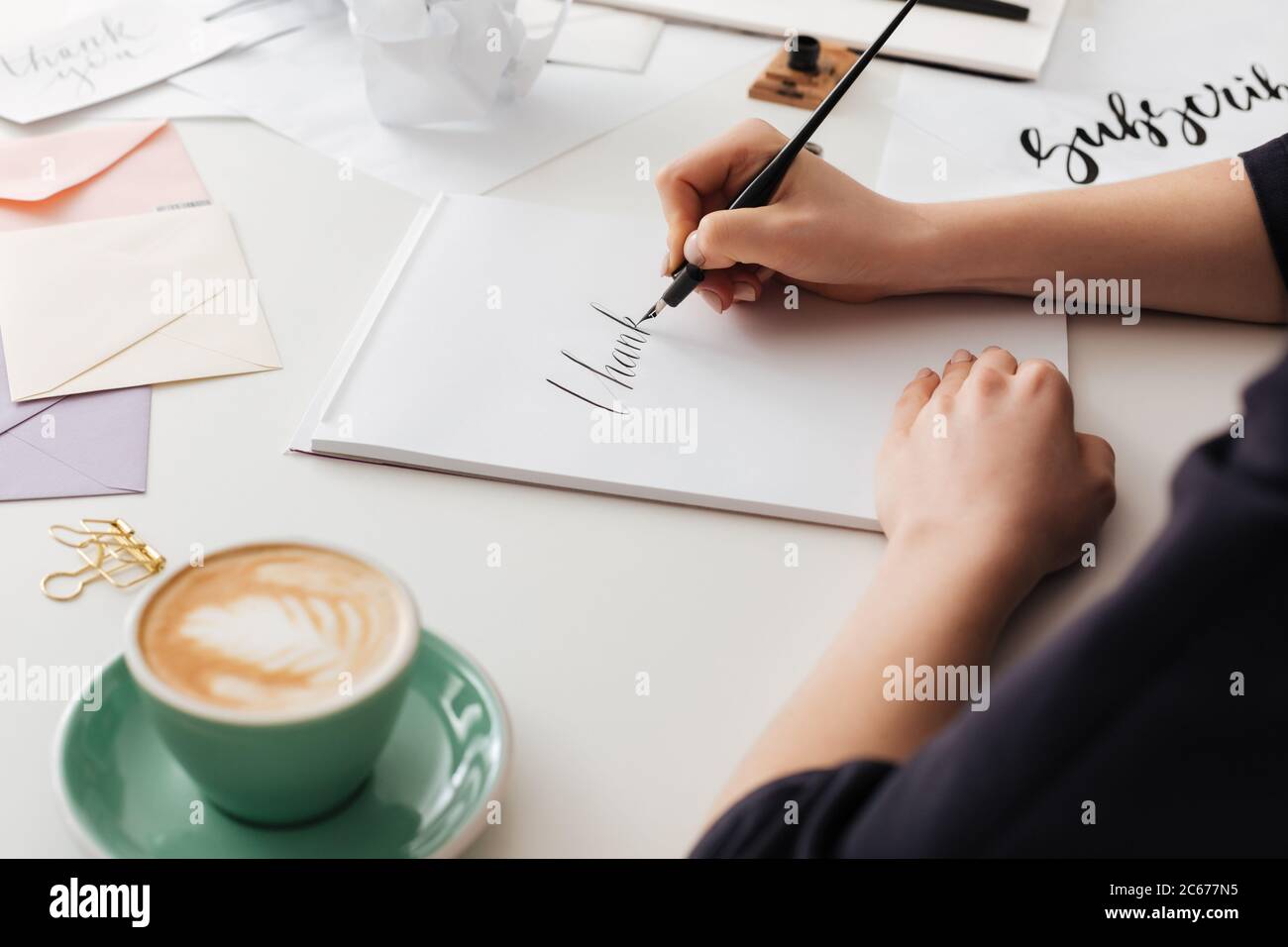 Beautiful photo of woman hands holding classic ink pen while writing ...