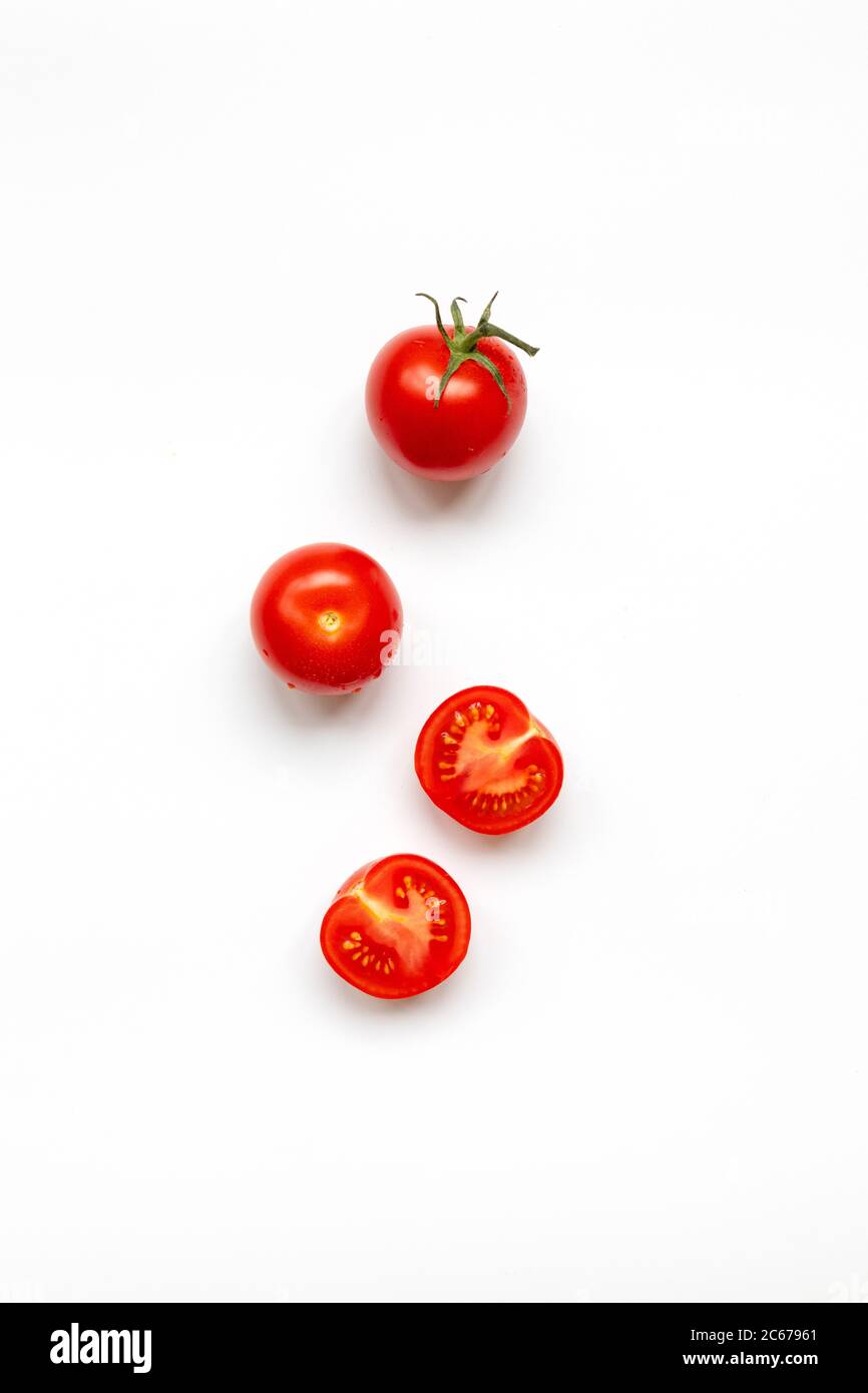 Fresh cherry tomatoes with water drop isolated on white background, top ...
