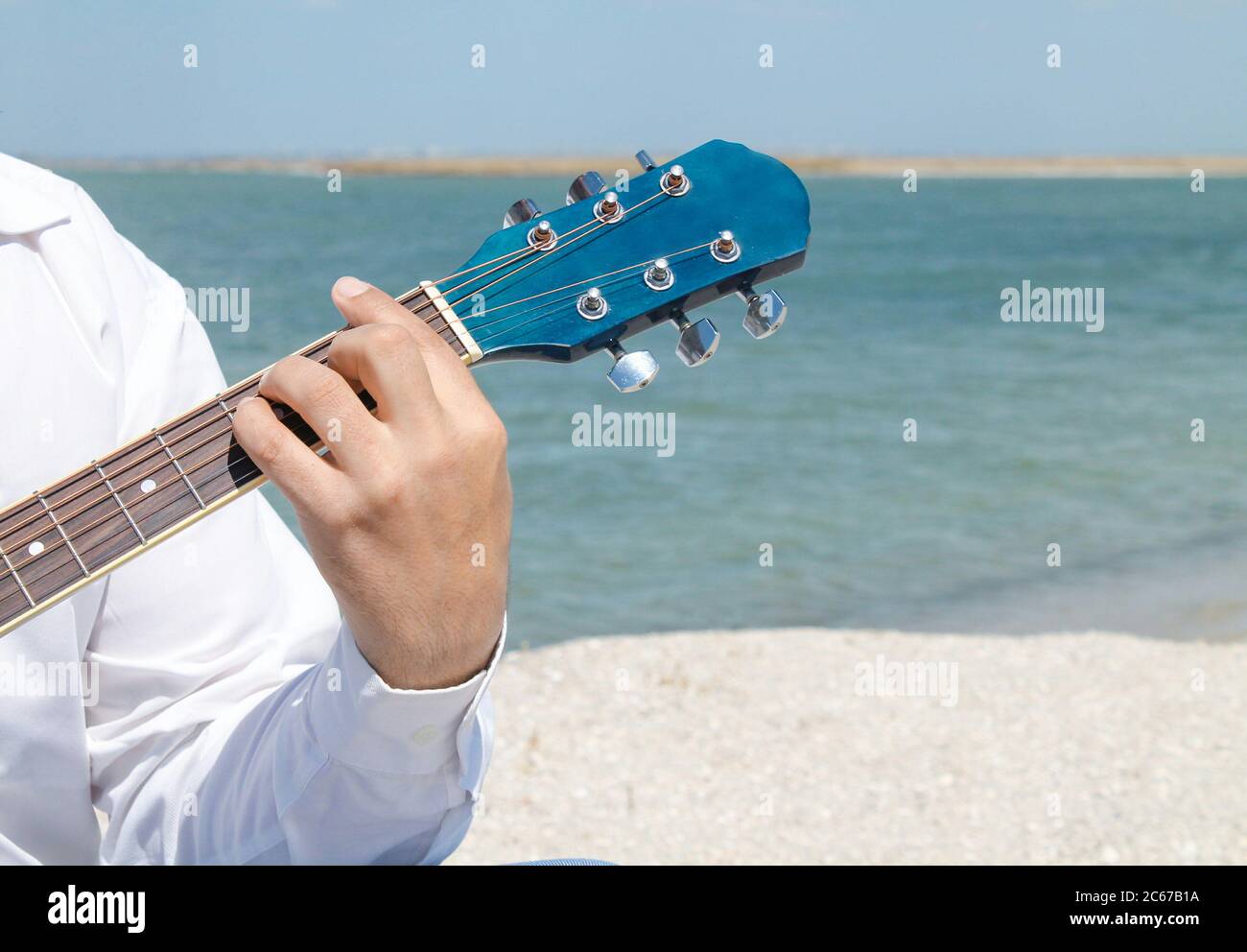 Playing instrument seaside hi-res stock photography and images - Alamy