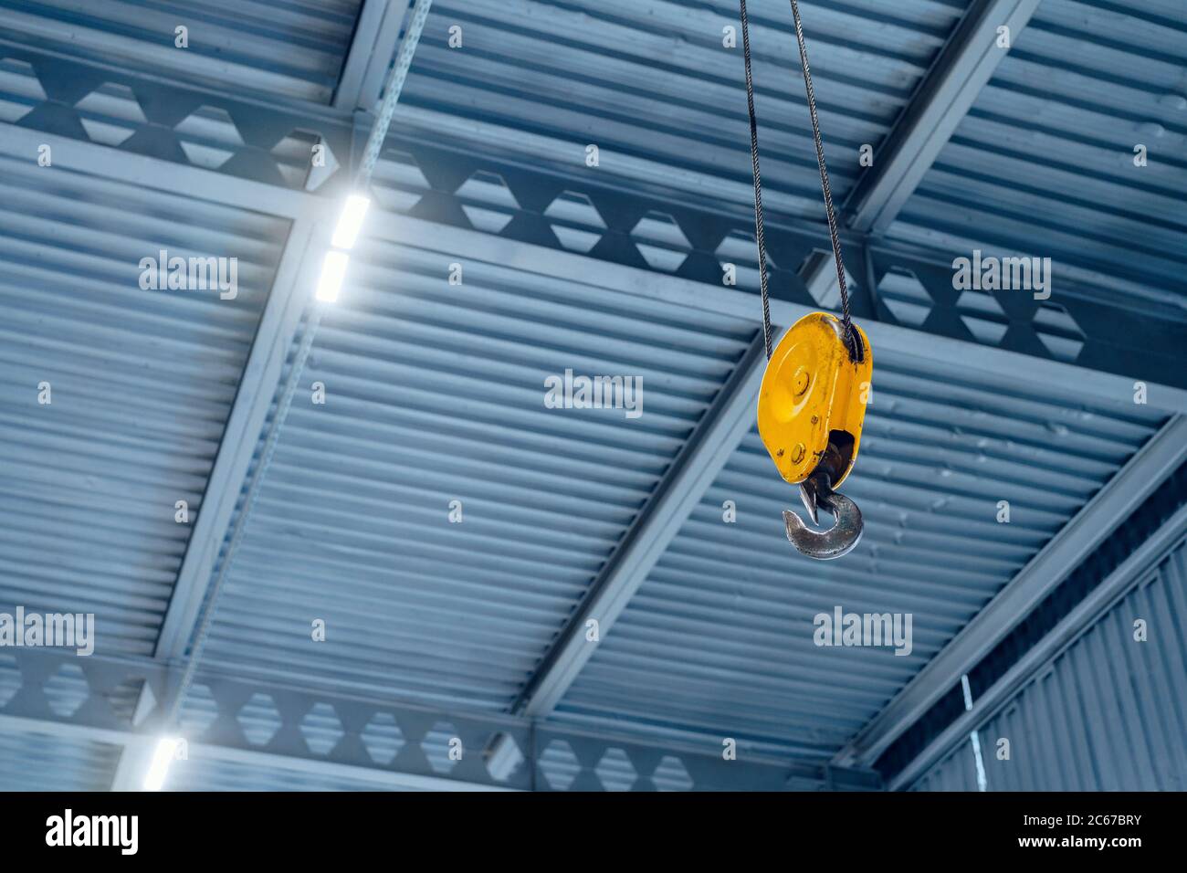 Industrial crane hook in a modern factory building Stock Photo - Alamy
