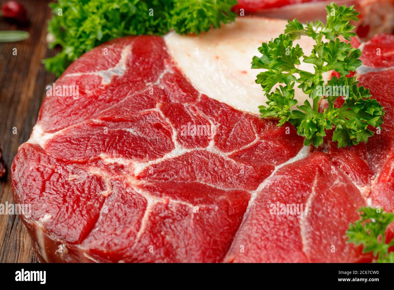 Raw meat slice for grill with seasoning Stock Photo - Alamy