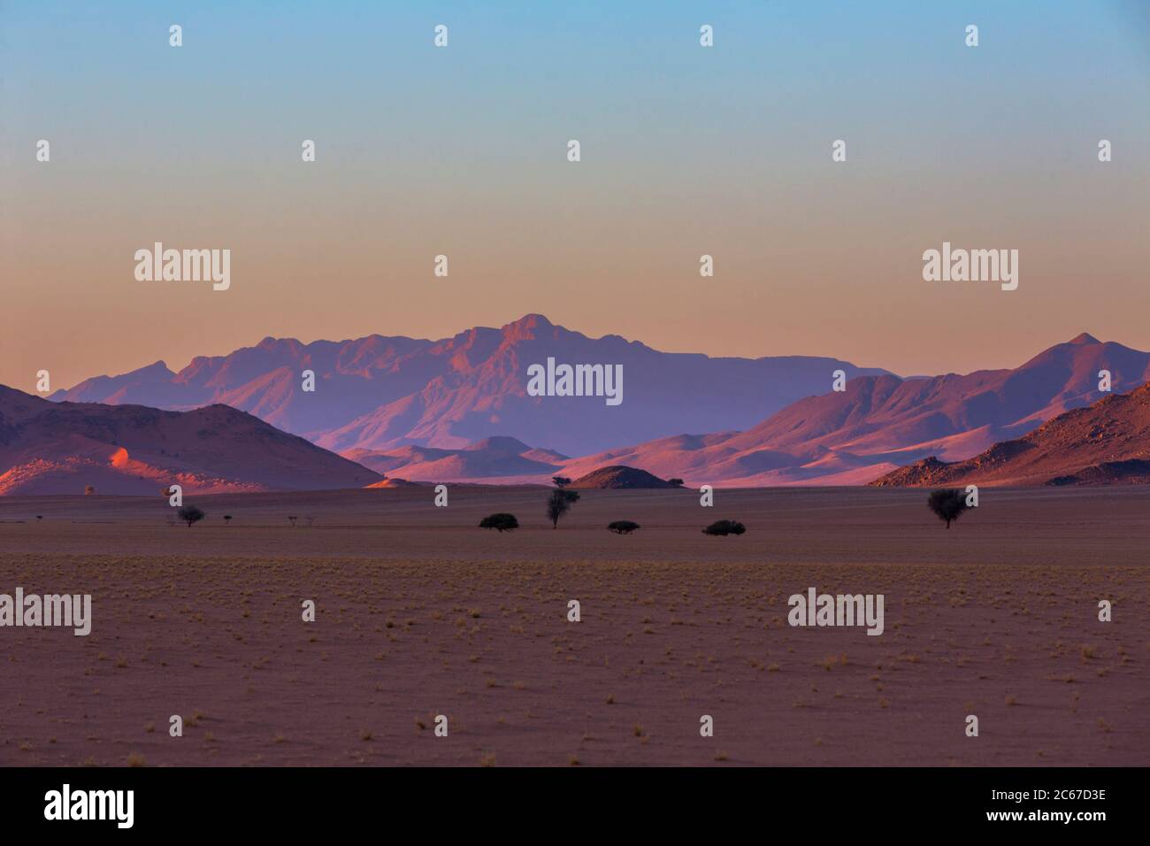 Mountains in late afternoon light Stock Photo - Alamy