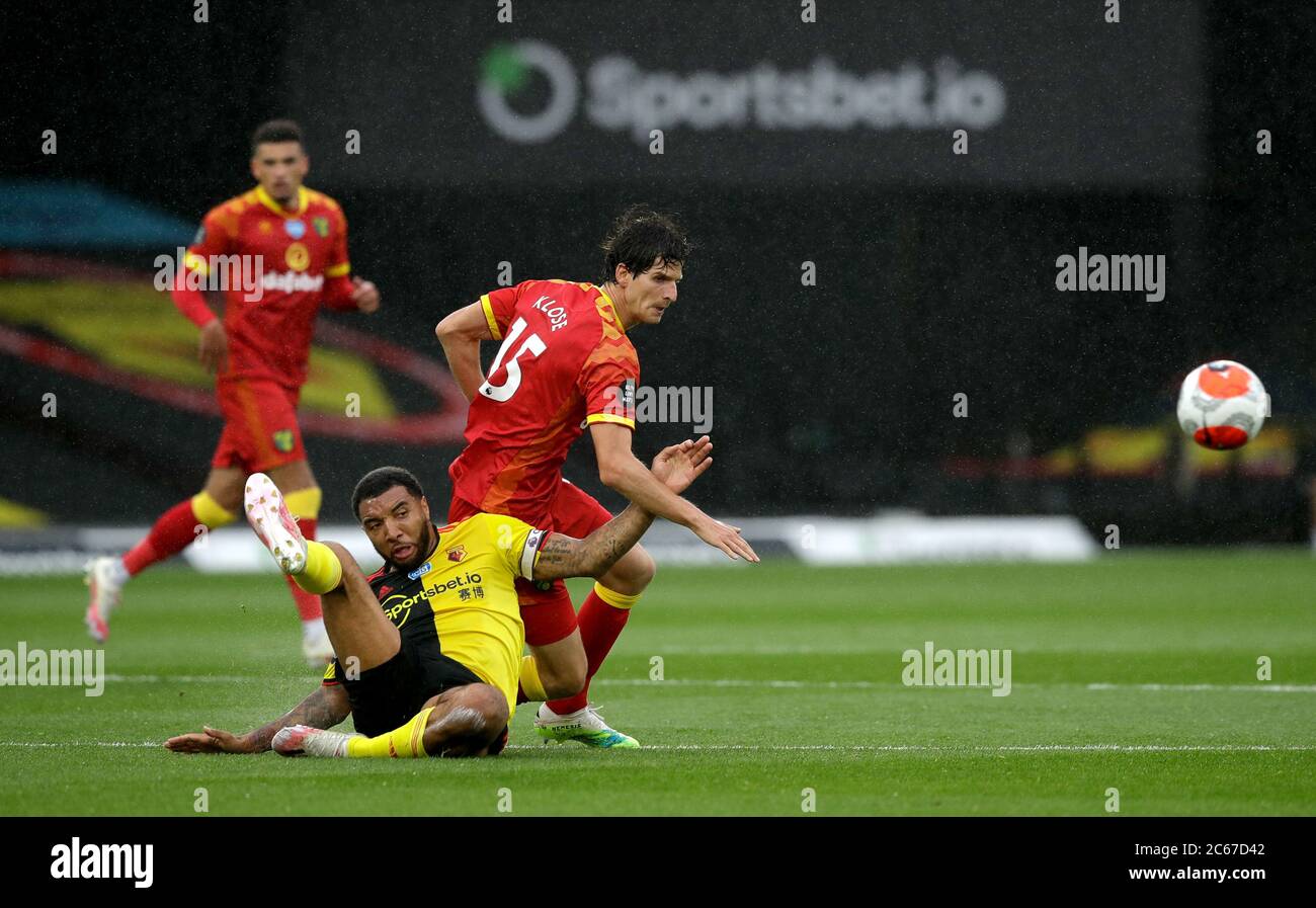 Norwich City's Timm Klose (right) and Watford's Troy Deeney (left ...