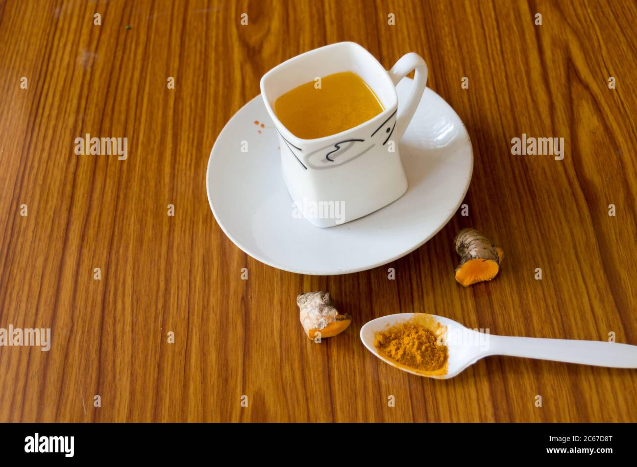 Golden turmeric milk bright yellow beverage Indian drink with Haldi ...