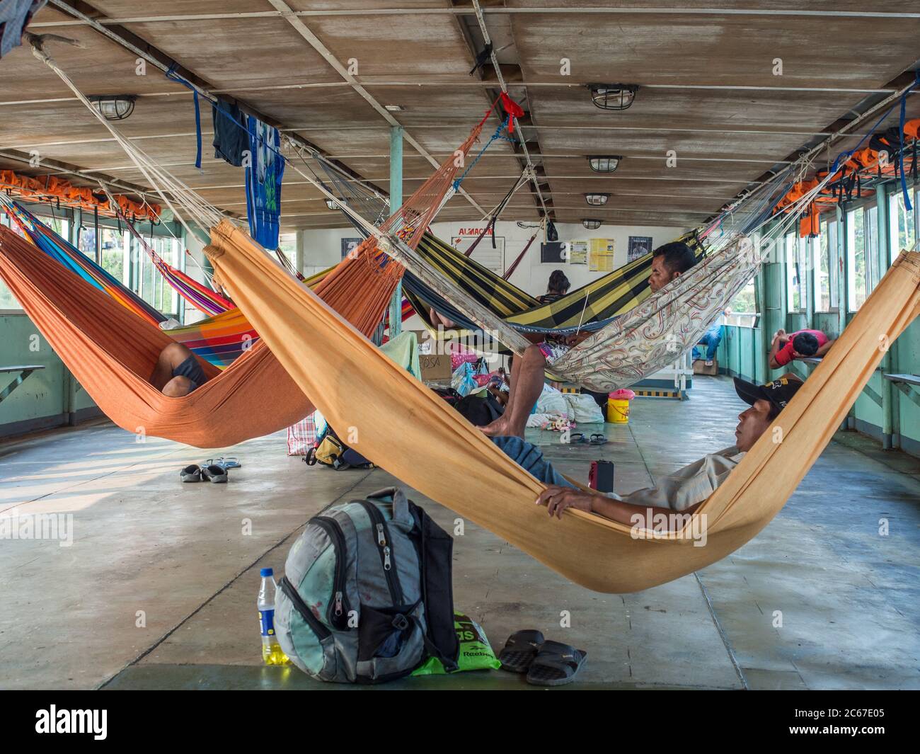 Amazon River, Peru - Sep 19, 2019: People on the hammocks on the cargo ...