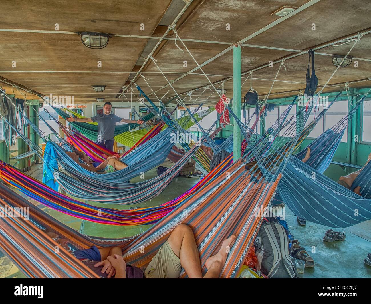 Amazon River, Peru - Sep 19, 2019: People on the hammocks on the cargo ...